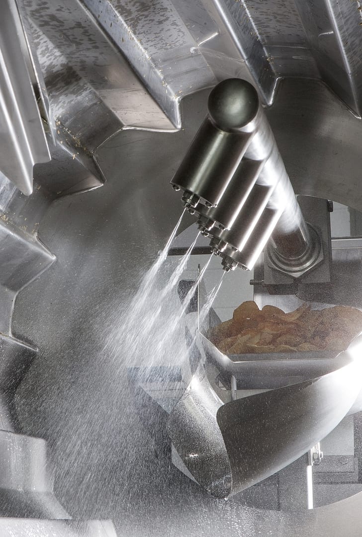 The Benefits of an Oil Spray System in Snack Manufacturing - KMG Systems